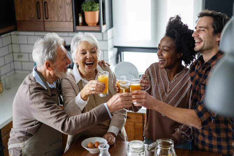 Multi Generation Multiethnic Family Having Fun, Talking Around a ...