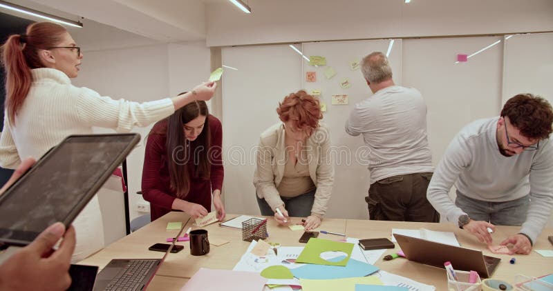 Team of Multi Generational, Creative People Brainstorming on a Project ...