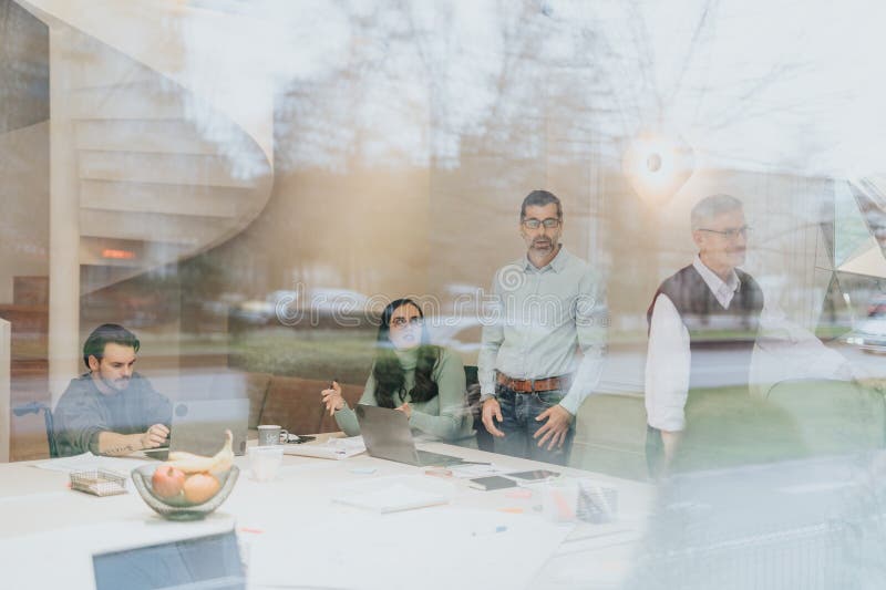 A Multi Generational Team of Employees Brainstorming and Collaborating ...