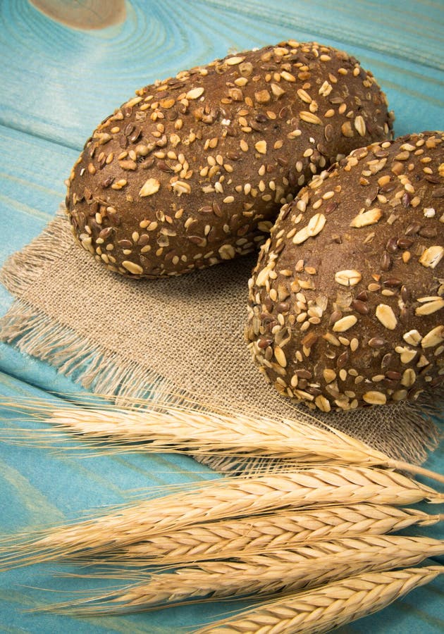 Multi-grain Bread Rolls on on Blue Wooden Table. Stock Image - Image of ...