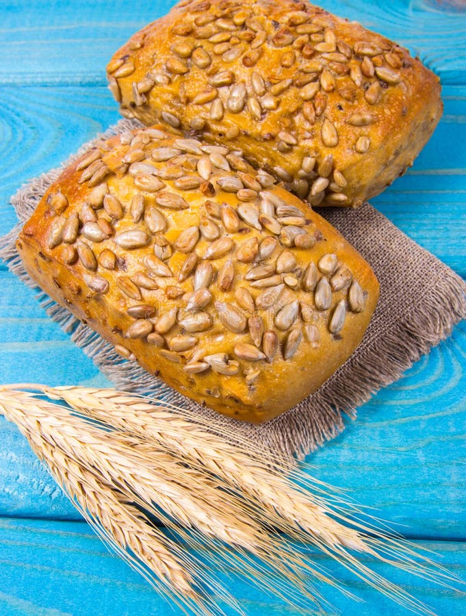 Multi-grain Bread Rolls on on Blue Wooden Table Stock Image - Image of ...