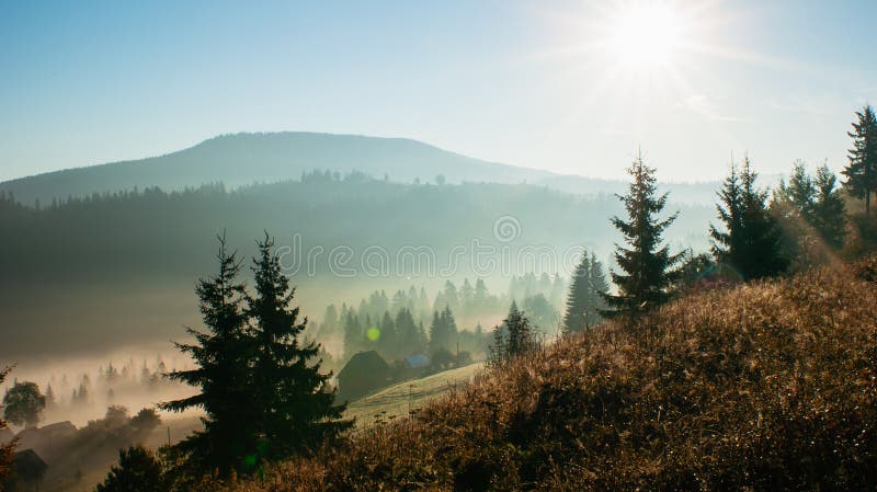 Multi-layered Landscape of Mountains at Dawn, Sunlight Breaking through ...