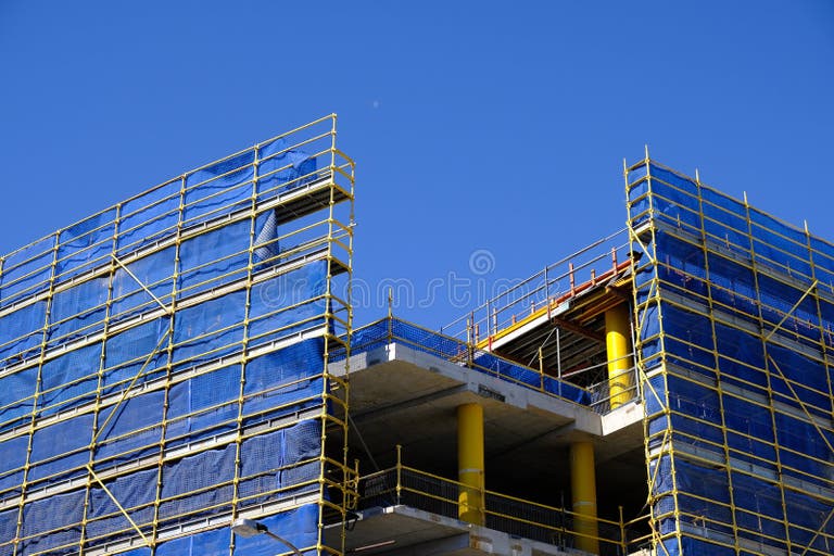 Scaffolding and Blue Safety Cladding on Construction Stock Photo ...
