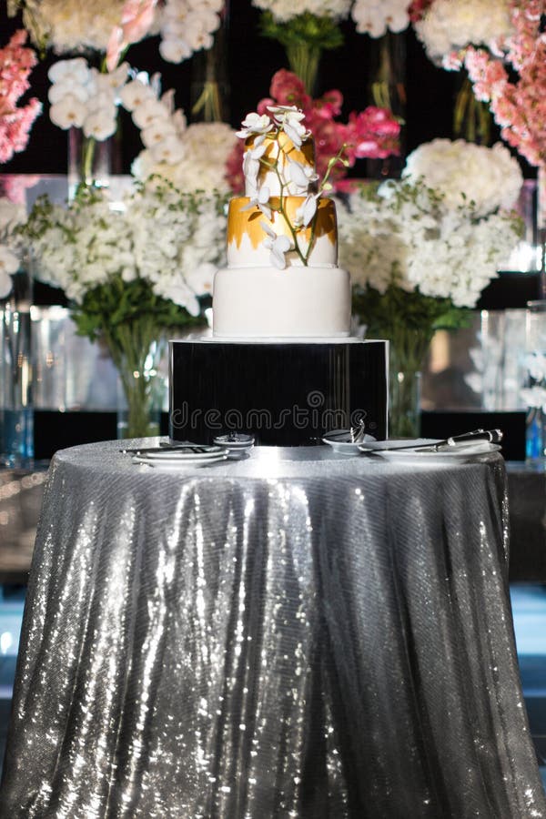 Multi Level Wedding Cake with Flowers on the Silver Table Stock Image ...