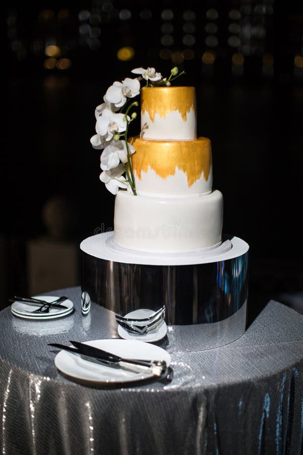 Multi Level Wedding Cake with Flowers on the Silver Table Stock Image ...