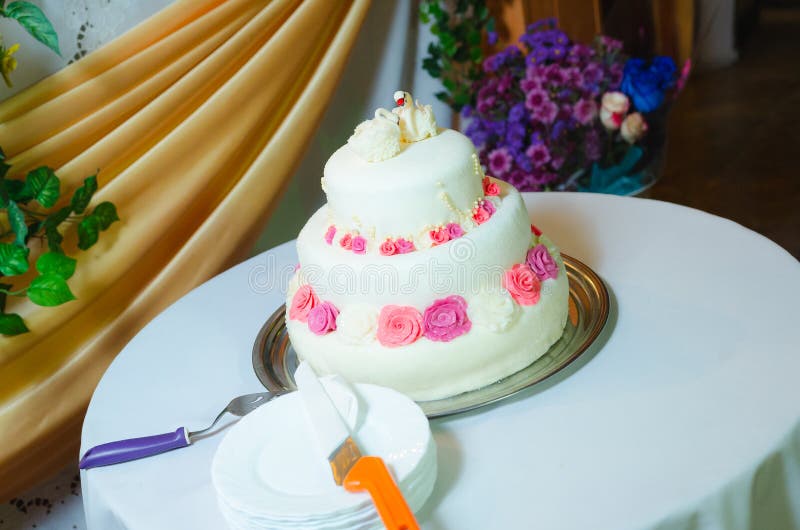 Multi Level Wedding Cake with Pink Flower Decorations Stock Photo ...