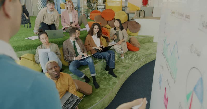 Multi-racial Business Team Working in Creative Coworking Place Talking ...