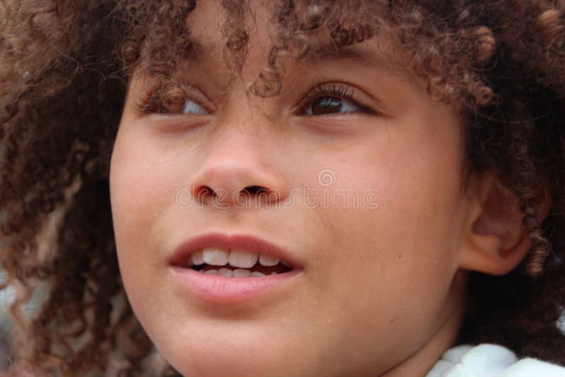 Multi Racial Tween Girl In Profile With Lots Of Curly Hair Stock Image ...