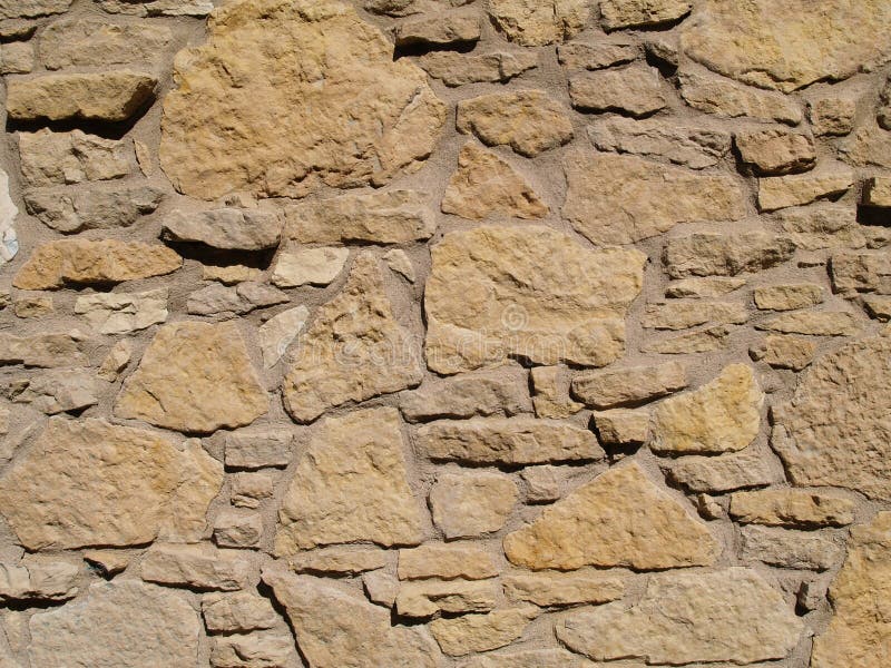 Multi-Sized Tan Stone Wall stock image. Image of masonry - 10610443