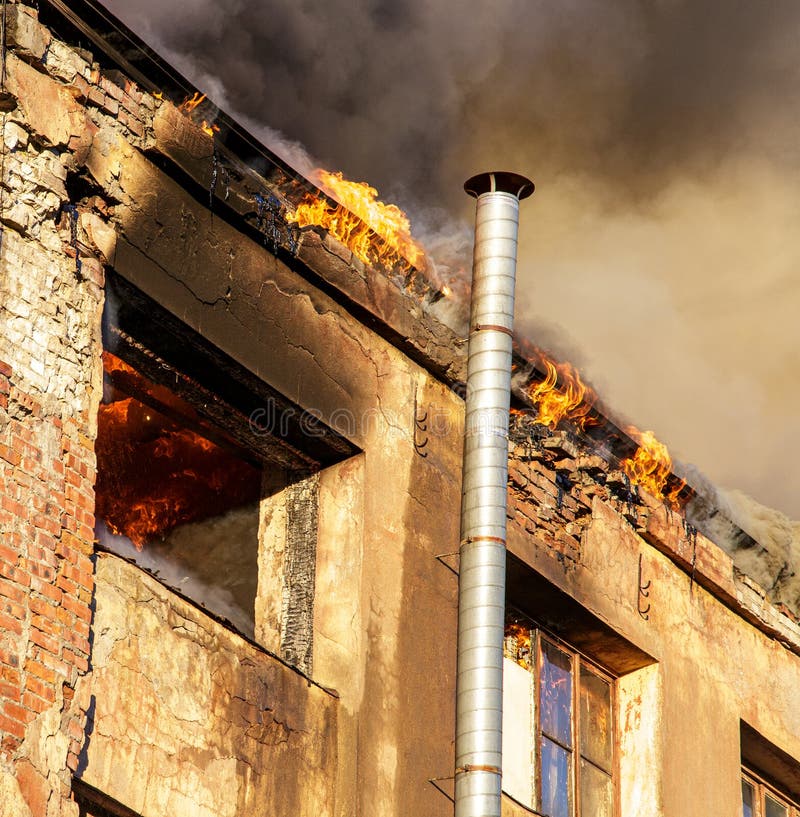 The Multi-storey Abandoned Building is Completely Engulfed in Fire and ...