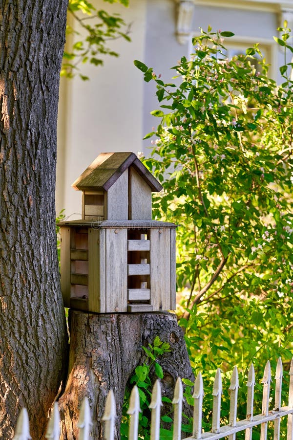 Multi Storey Bird House on a Tree Stump in the Park Stock Image - Image ...