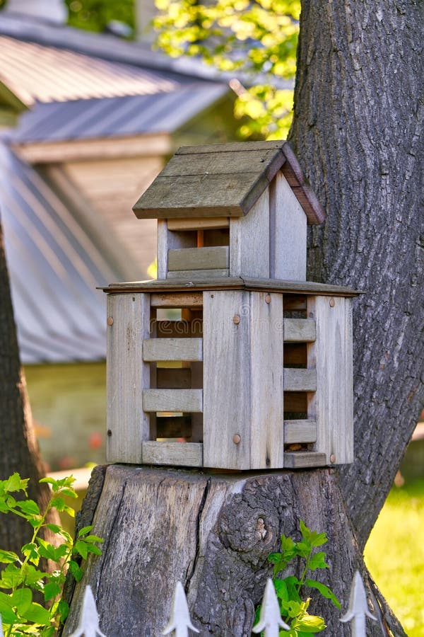 Multi Storey Bird House on a Tree Stump in the Park Stock Image - Image ...
