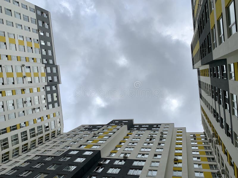 Multi-storey Building Against a Cloudy Sky. Tall New Building with ...