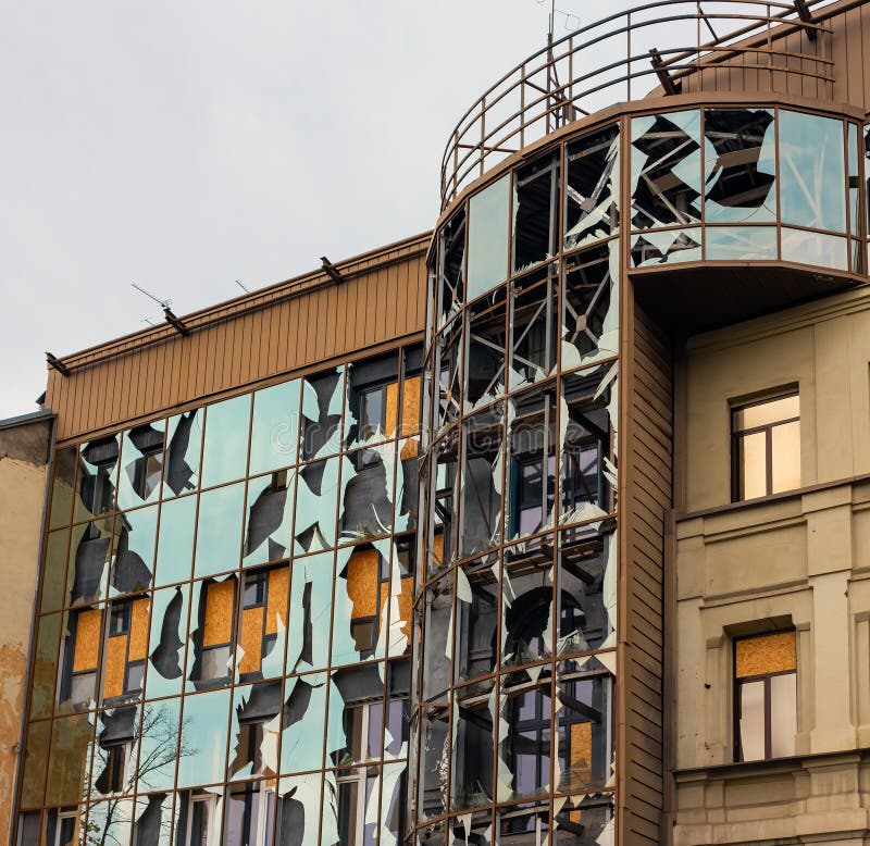Multi-storey Building with a Damaged Facade and Broken Glass in the ...