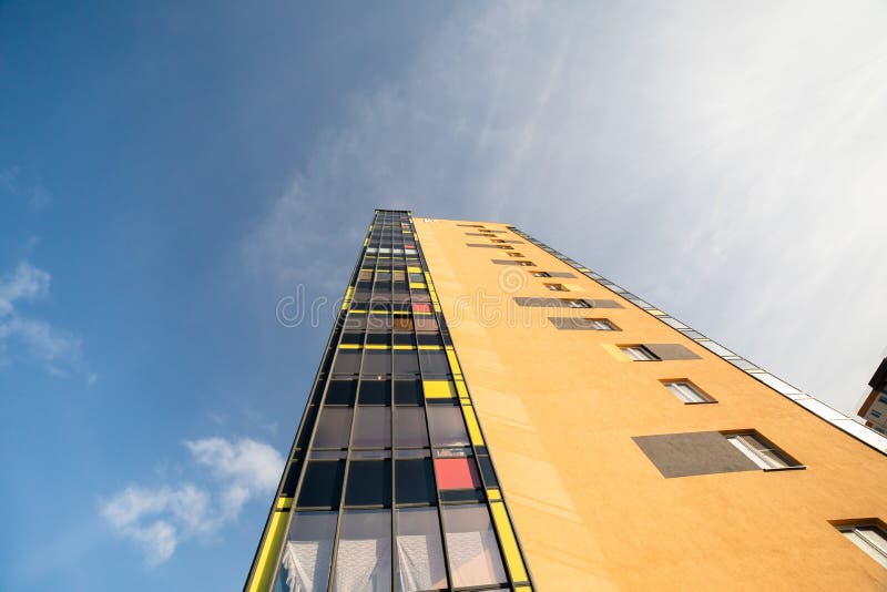 The Multi-storey Building is Tall Against the Blue Sky in Good Weather ...