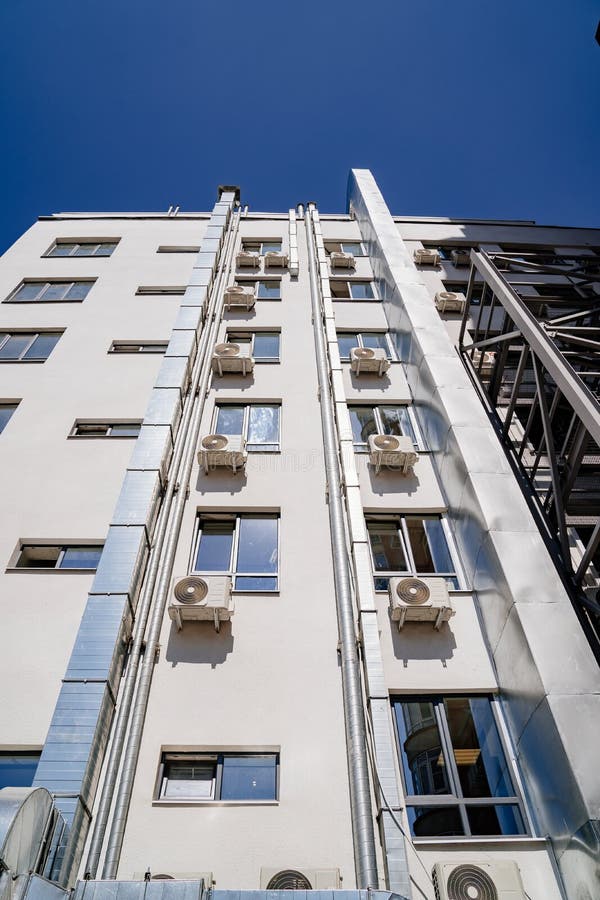 Multi-storey Building with Windows and External Air Conditioning Units ...