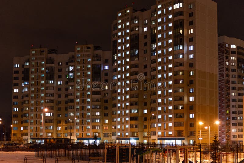 Multi-storey houses night stock image. Image of glass - 240220111