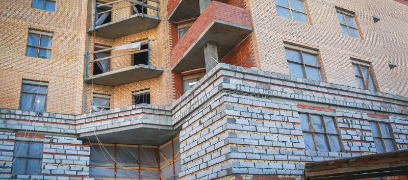 A Multi-story Building Under Construction, Showcasing Brickwork ...