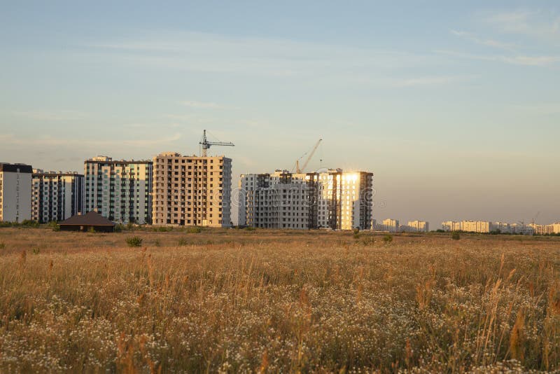 Multi-story Complex of Houses, Construction is Underway, Cranes are ...