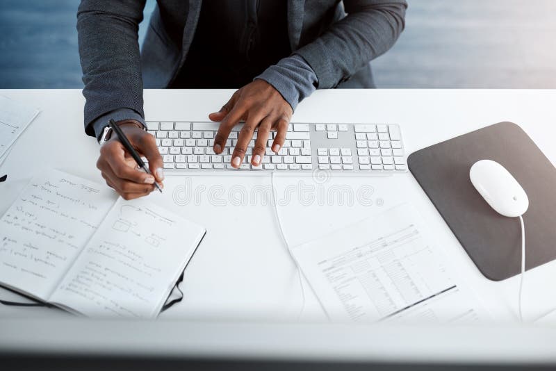 Multi-taskers Stay on Top of Work. High Angle Shot of a Businessman ...