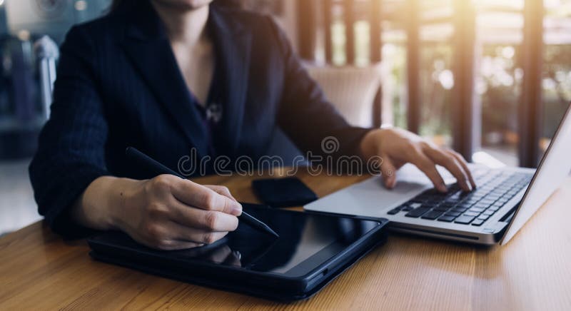 Multi-tasking Businessman Working in the Office. he is Using Touchpad ...
