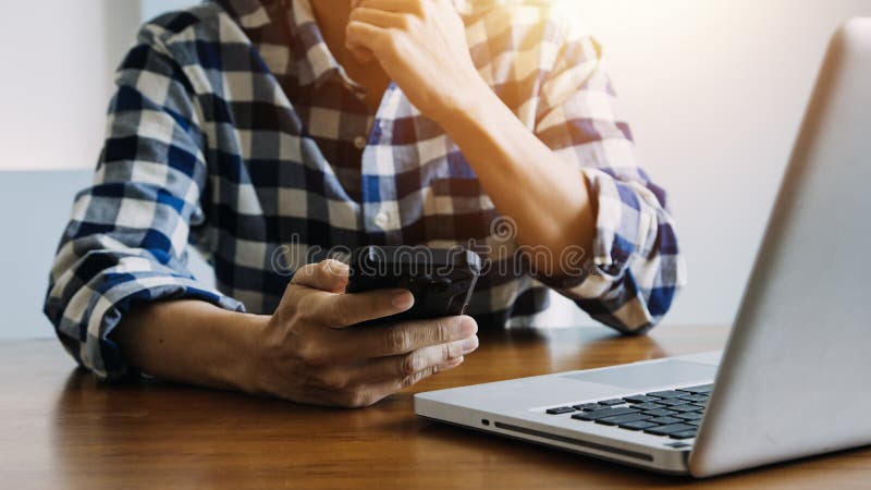 Multi-tasking Businessman Working in the Office. he is Using Touchpad ...