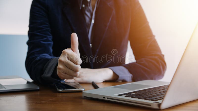 Multi-tasking Businessman Working in the Office. he is Using Touchpad ...