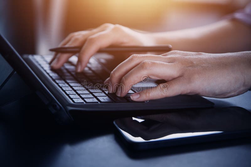 Multi-tasking Businessman Working in the Office. he is Using Touchpad ...