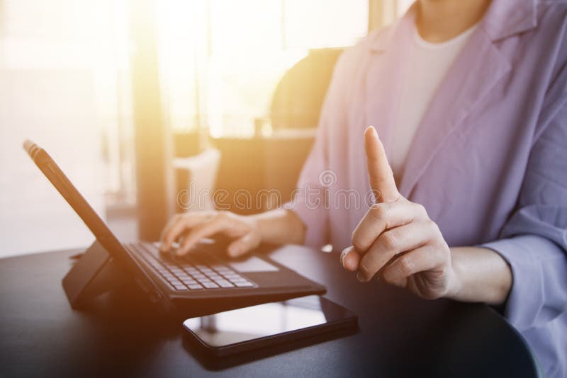 Multi-tasking Businessman Working in the Office. he is Using Touchpad ...