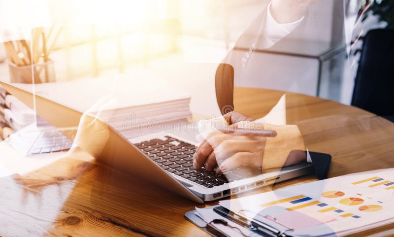 Multi-tasking Businessman Working in the Office. he is Using Touchpad ...