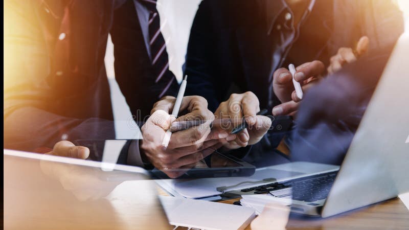 Multi-tasking Businessman Working in the Office. he is Using Touchpad ...