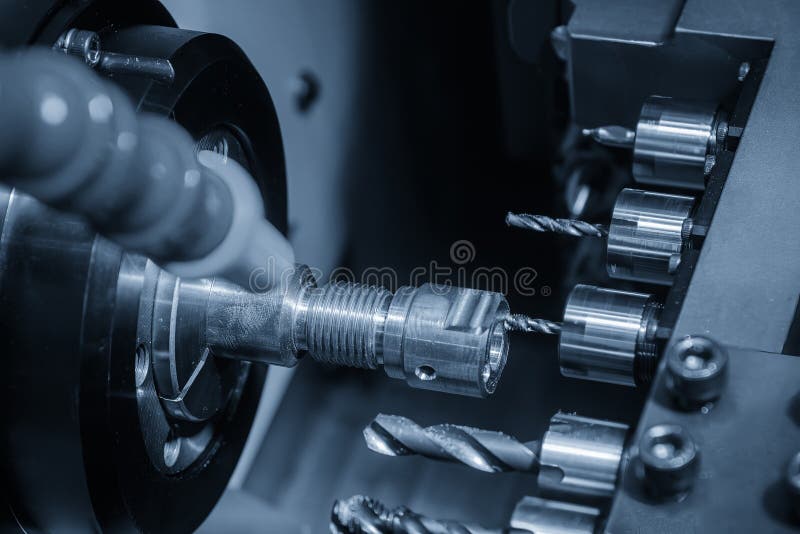 The Multi Tasking CNC Lathe Machine Swiss Type Tapping the Brass ...