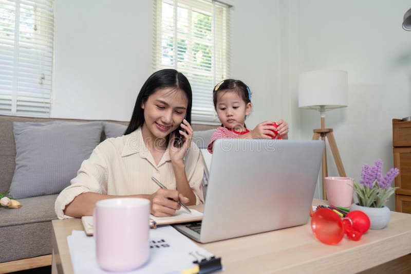 Multi Tasking Mother Balances Remote Work and Childcare Using Tech ...