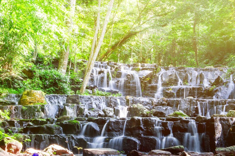 Multi-Tiered Waterfall in Lush Green Forest Stock Image - Image of ...