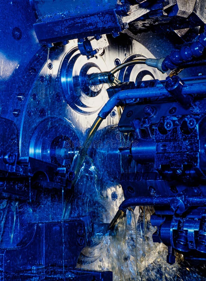 Multi-tool CNC Milling Machine with Jets of Oil with Blue Light Stock ...