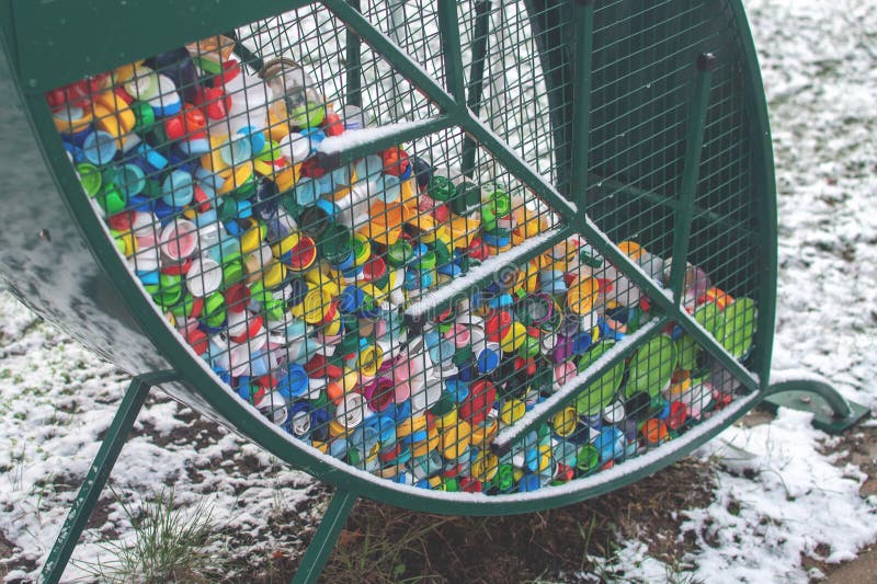 Multicolor Caps from Plastic Bottles are Collected in a Container for ...