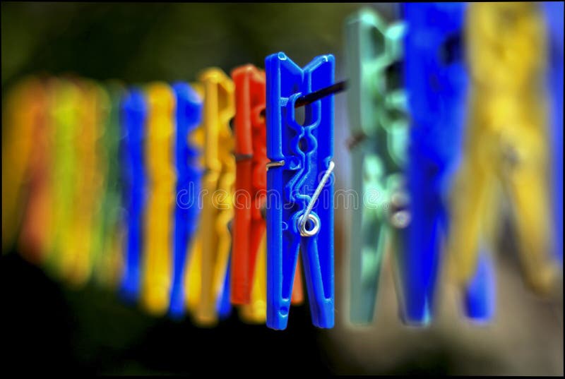Multicolor Pegs Hanging on Rope Stock Image - Image of abstract ...