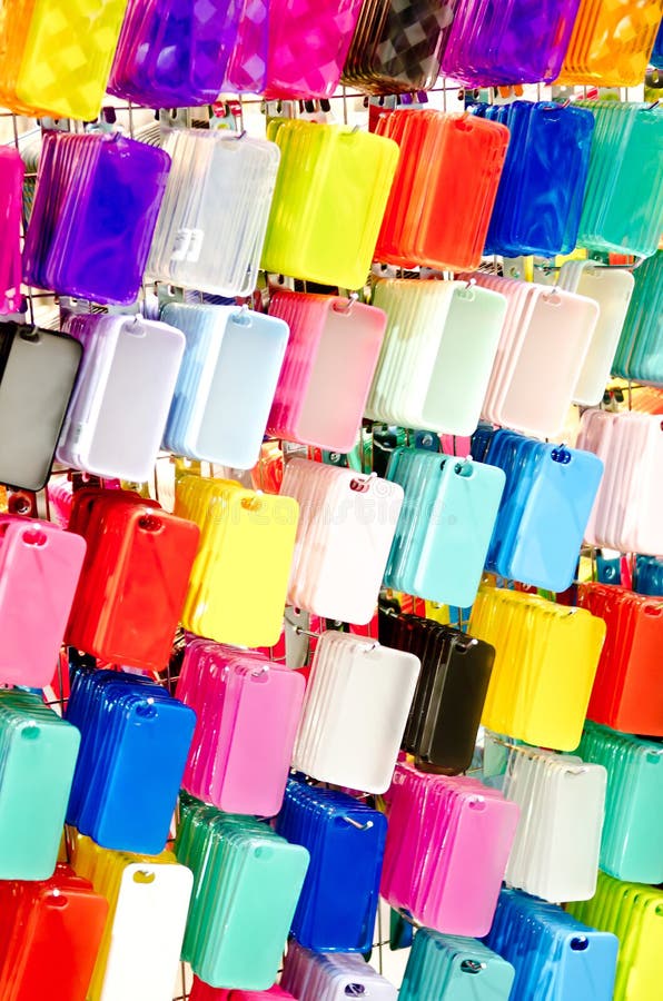 MultiColor Plastic Mobile Phone Cases on Hangers Stock Image - Image of ...