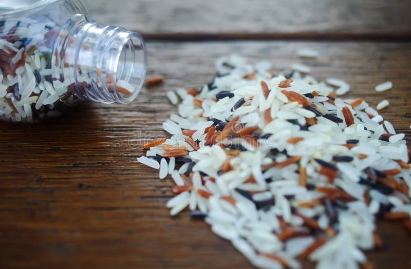 Multicolor Sprinkle Rice from the Bottle on the Wooden Table Stock ...