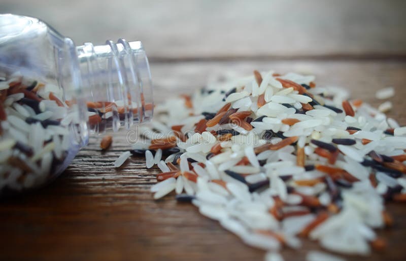 Multicolor Sprinkle Rice from the Bottle on the Wooden Table Stock ...