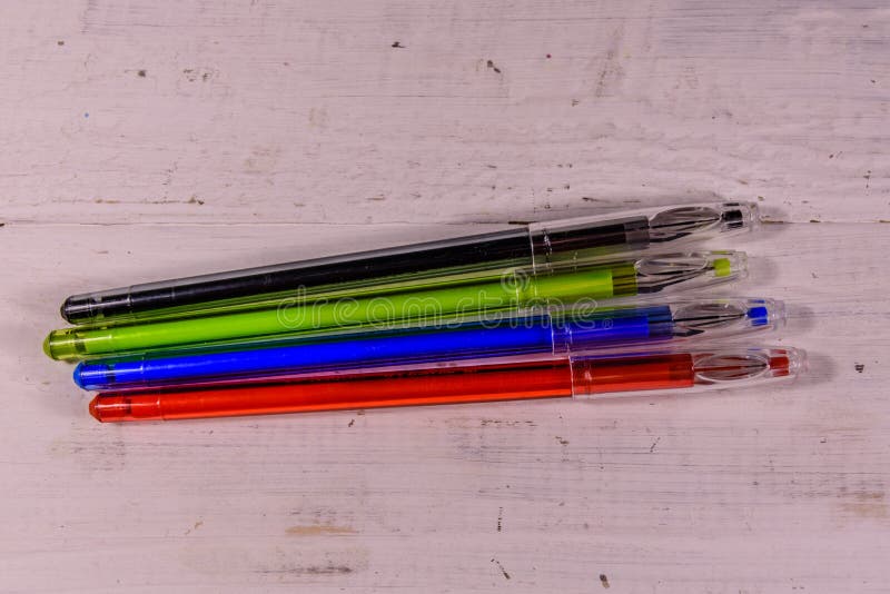 Multicolored Ball Pens on a Wooden Table. Top View Stock Photo - Image ...