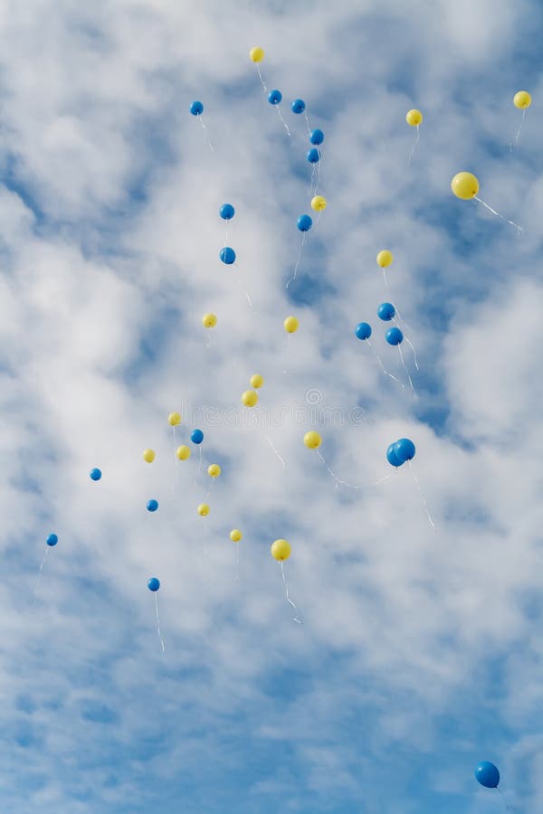 Multicolored Balloons Fly in Clear Blue Sky with Clouds Stock Photo ...