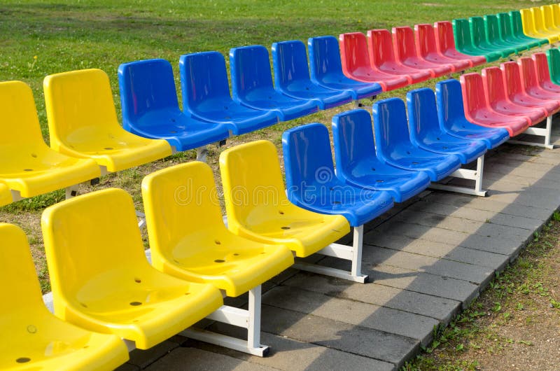 Multicolored Benches for Sports Fans Standing in Two Rows. Stock Image ...