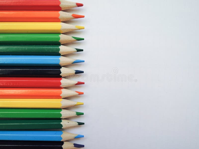 Multicolored Bright Pencils of the Same Size Lie Flat on White Paper ...