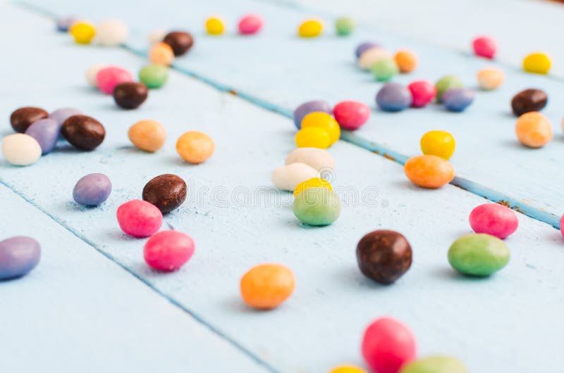 Multicolored Candies Scattered on a Wooden Table Stock Photo - Image of ...