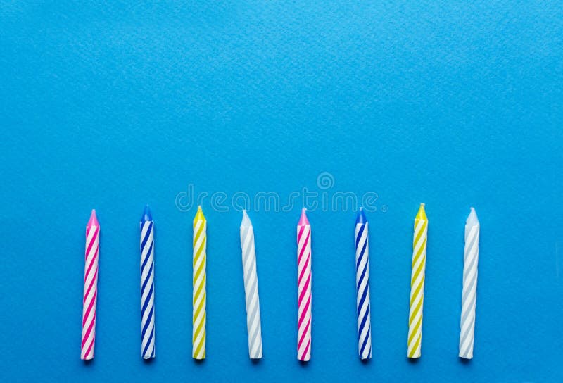 Multicolored Candles for Cake on Paper Background Stock Photo - Image ...