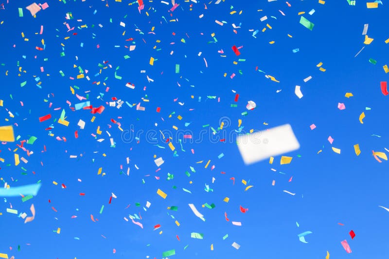 Multicolored Confetti on Clear Blue Sky Background. Concept of H Stock ...