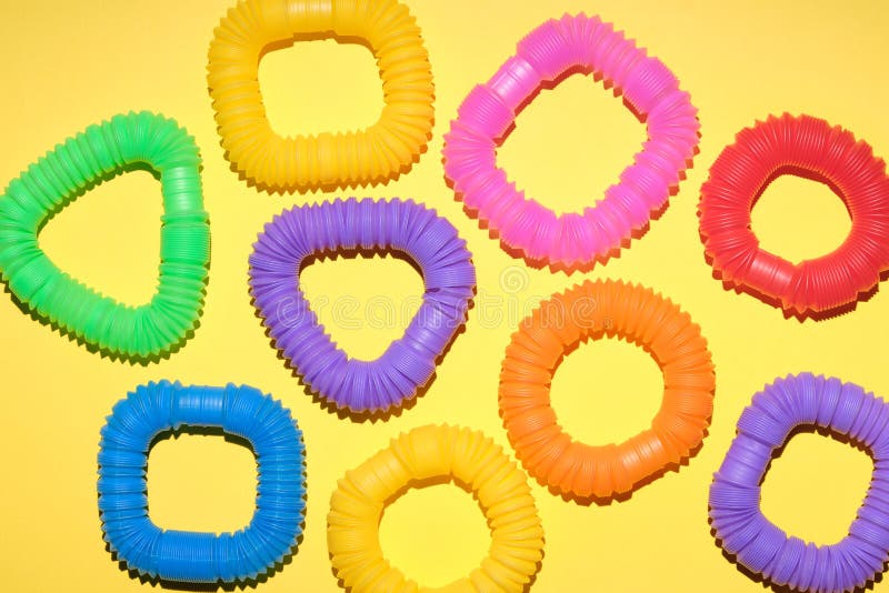 Multicolored Corrugated Plastic Pipes Poptube Toy on a Bright ...