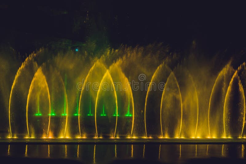 Multicolored Dancing Water Jet Fountain in the Dark Stock Image - Image ...