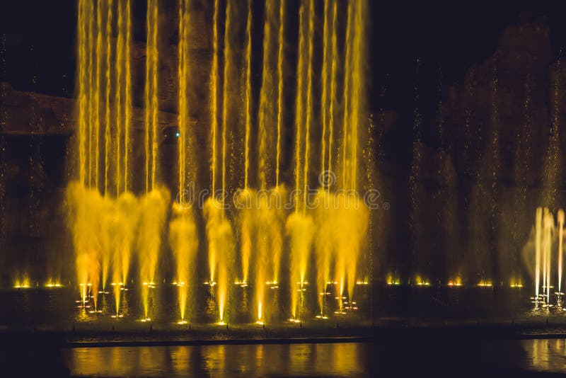 Multicolored Dancing Water Jet Fountain in the Dark Stock Image - Image ...